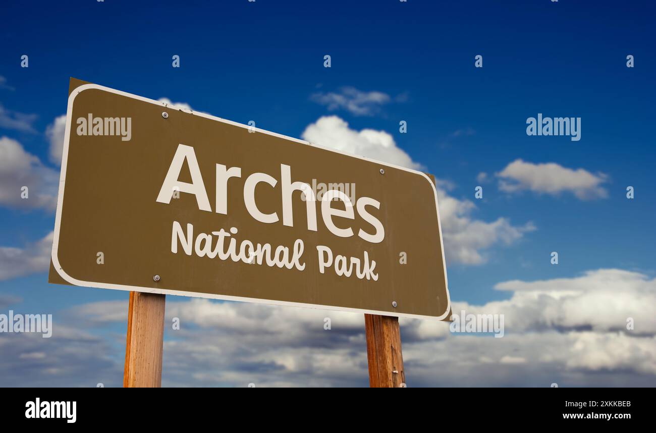 Arches National Park (Utah) Road Sign Against Blue Sky and Clouds Stock ...