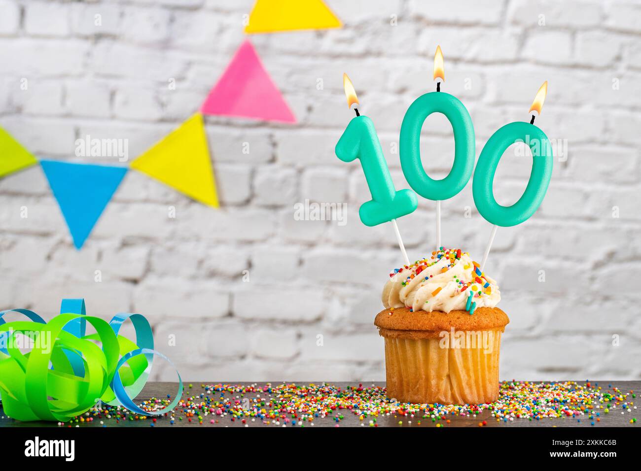 Candle number 100 - Birthday celebration with cupcake Stock Photo - Alamy
