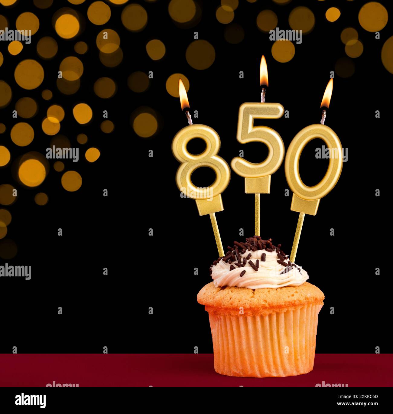 Birthday candle with cupcake - Number 850 on black background with out ...