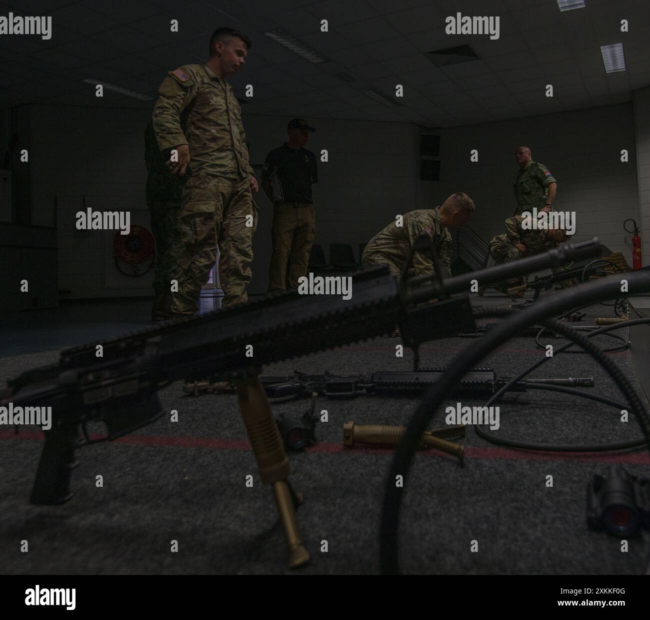 Service members representing team USA receive a simulated Colt C7NLD ...