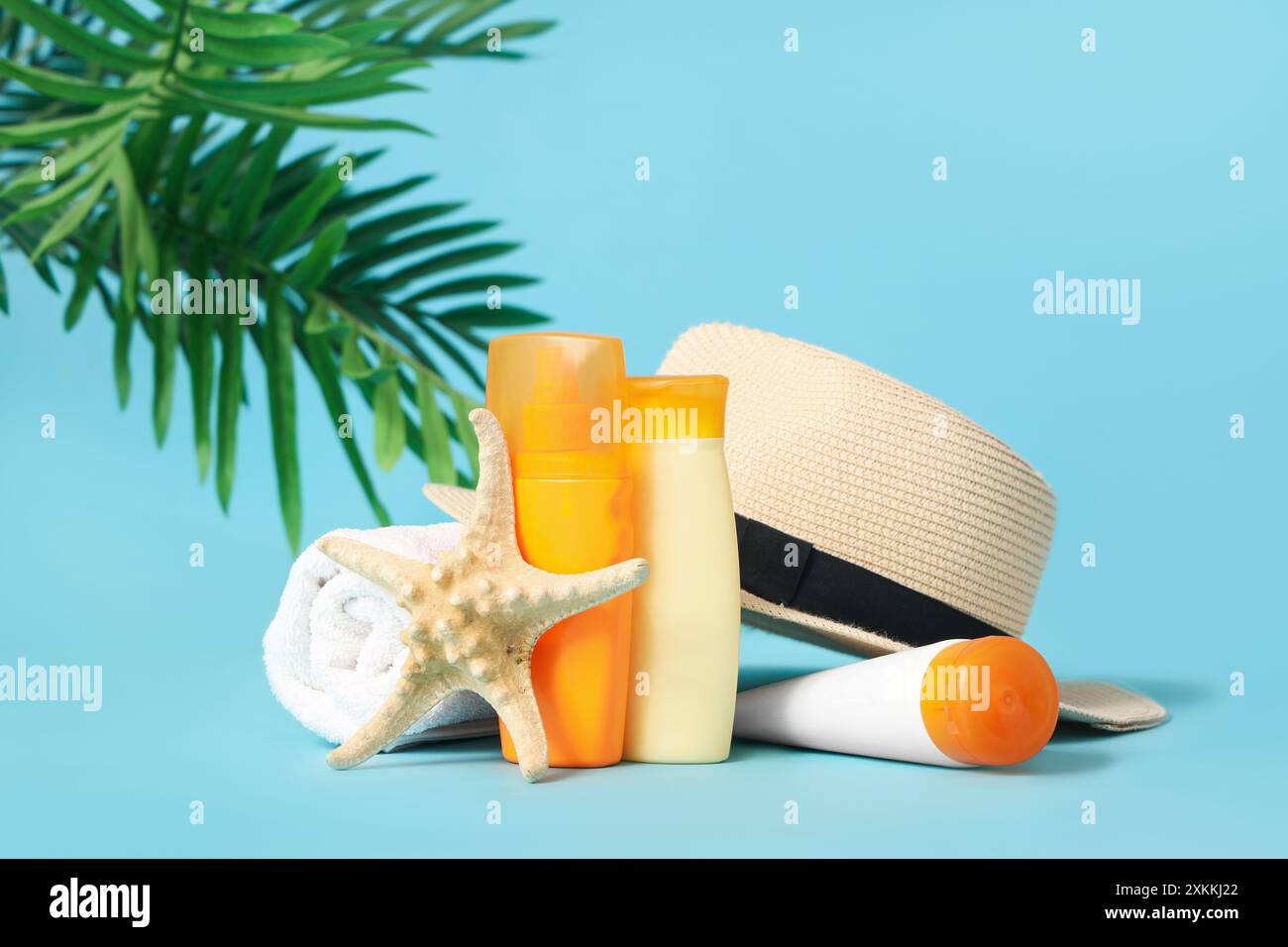 Bottles of sunscreen products on blue background Stock Photo - Alamy