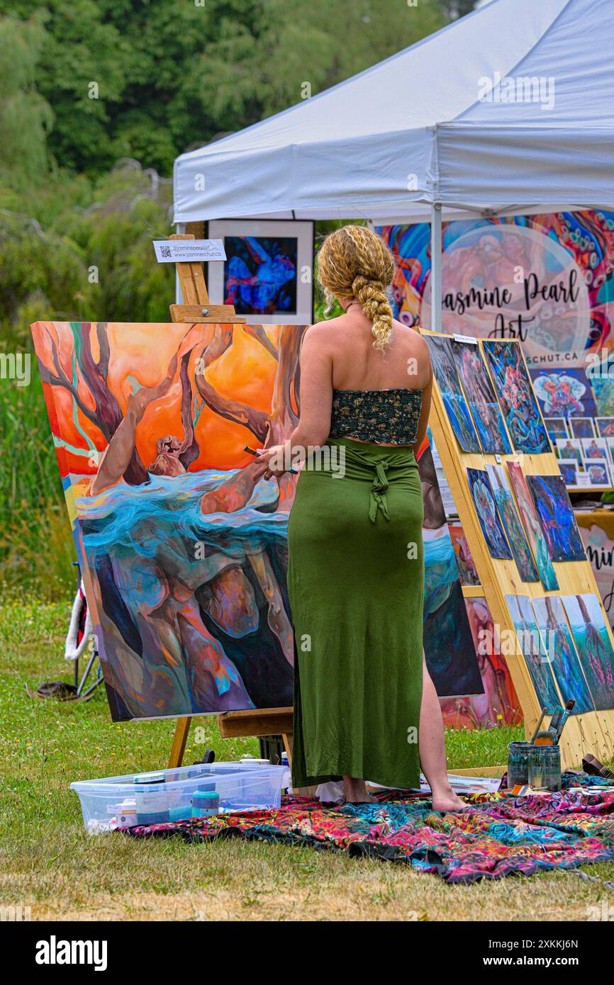 Artist Jasmine Pearl, painting at her booth, Vancouver, British ...