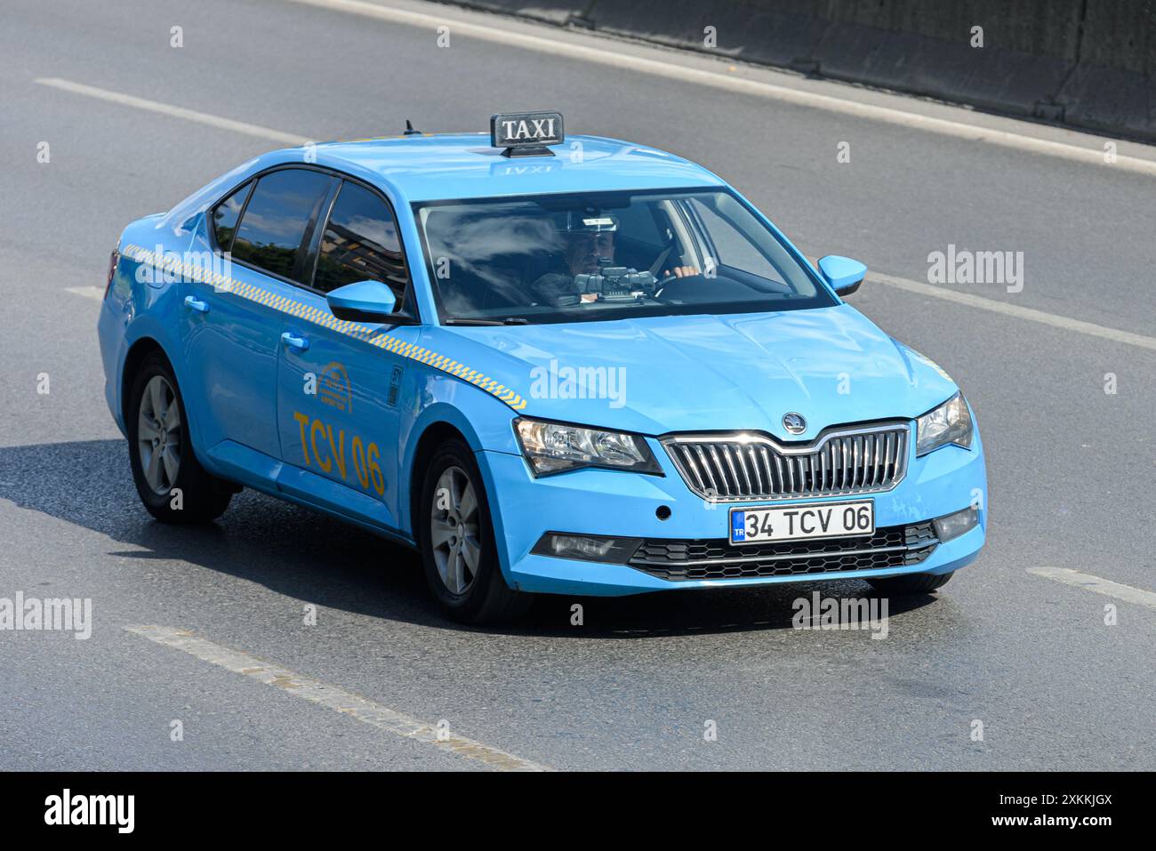 ISTANBUL, TURKEY - JULY 10, 2024: Turkish blue taxi on the way in ...