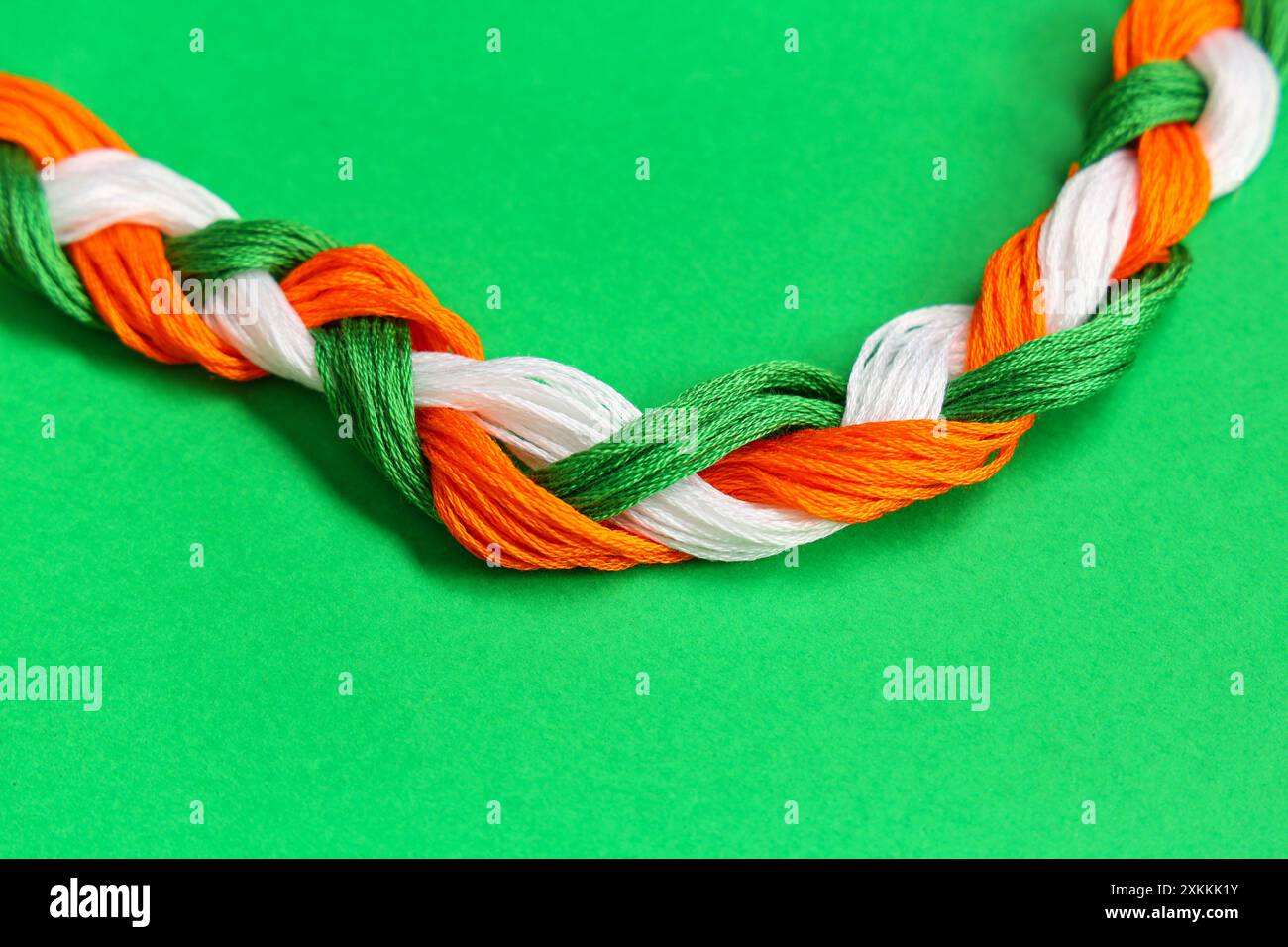 Braided embroidery threads in colors of Indian flag on green background ...