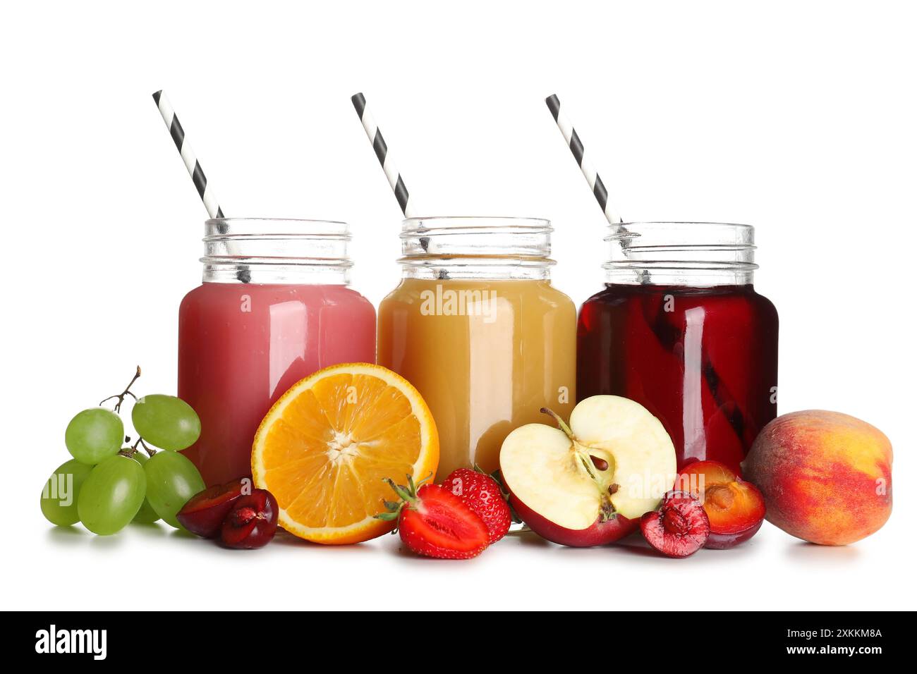 Mason jars of fresh juice with different fruits on white background ...