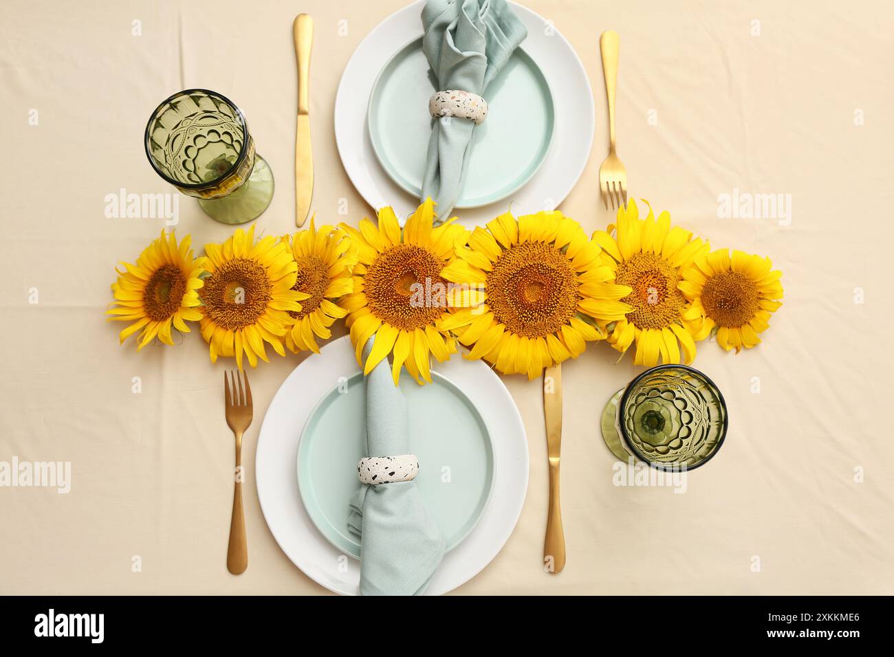 Sunflowers on served dining table. Top view Stock Photo - Alamy