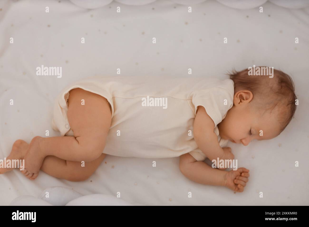 Cute little baby sleeping in crib, top view Stock Photo - Alamy