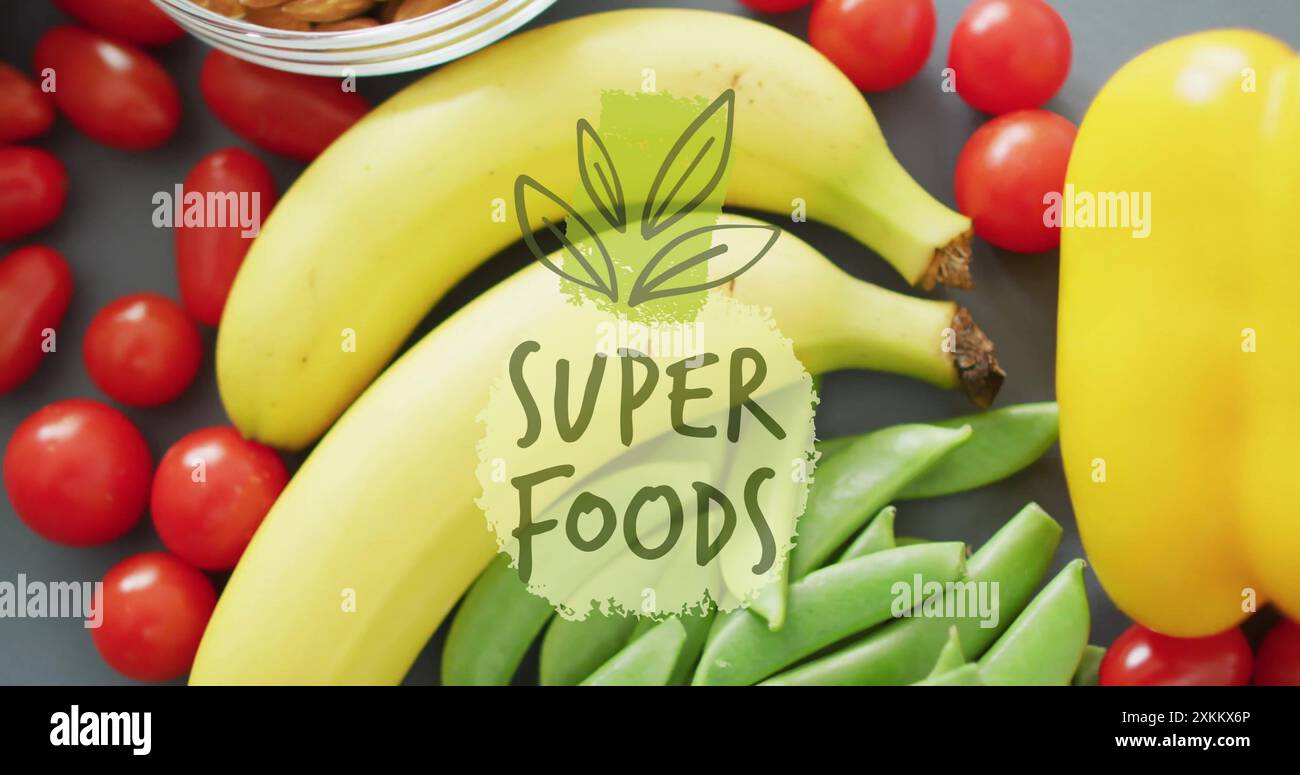 Super Foods text image over bananas, cherry tomatoes, almonds, and snap ...