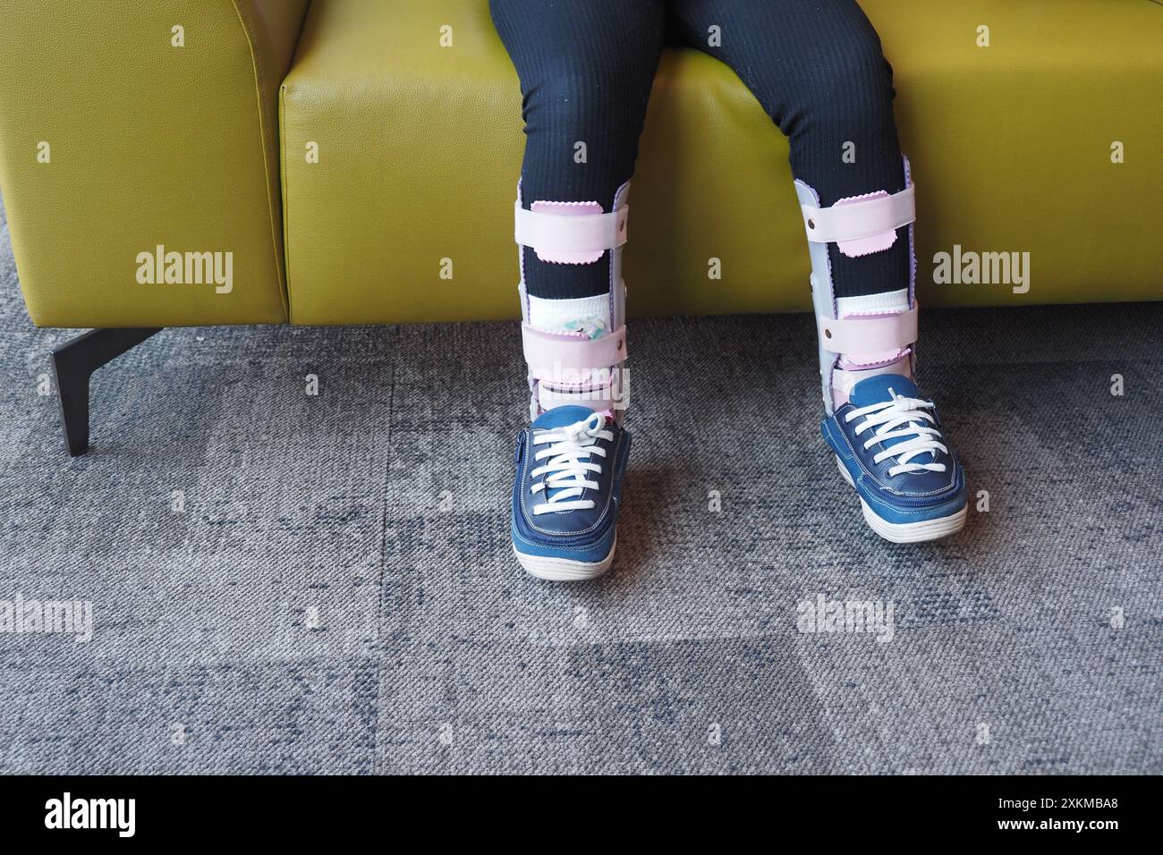 Child cerebral palsy disability, legs orthosis Stock Photo - Alamy