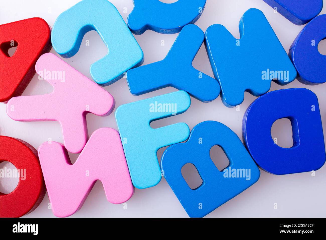 Colorful alphabet letter blocks scattered randomly on white background ...