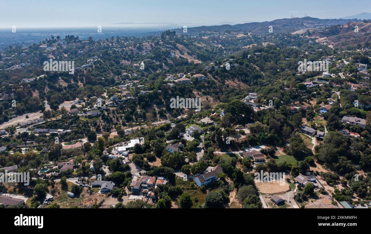 Afternoon aerial view of the sprawling neighborhood houses and hills of ...