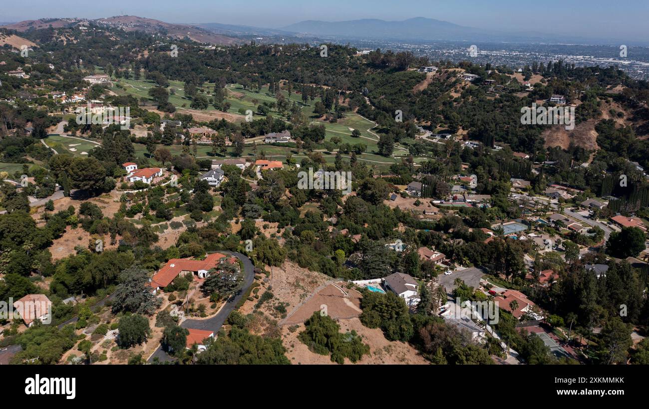 Afternoon aerial view of the sprawling neighborhood houses and hills of ...