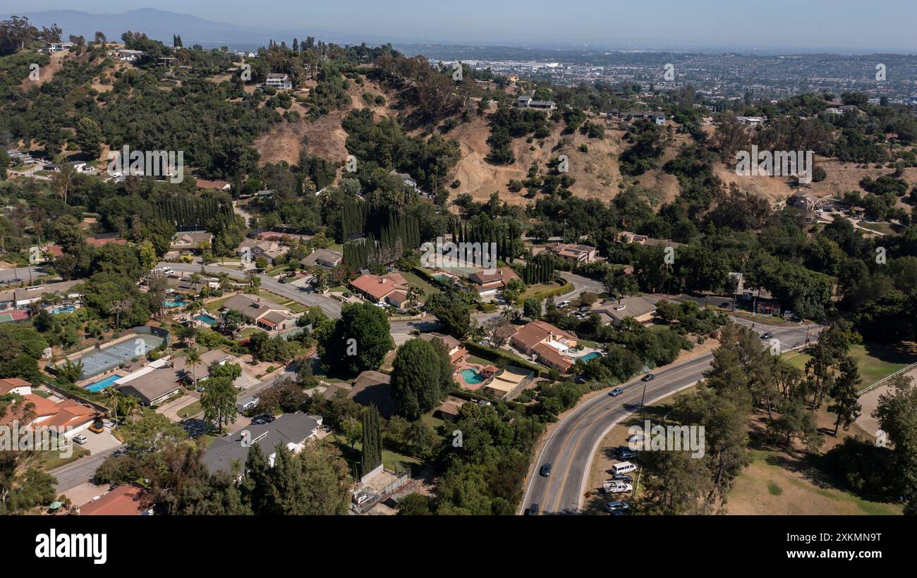Afternoon aerial view of the sprawling neighborhood houses and hills of ...