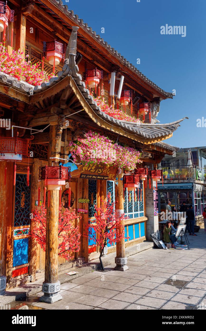 Facade of traditional Chinese house decorated with flowers, Dali Stock ...
