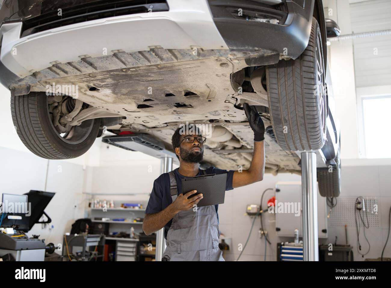 Inspecting vehicle undercarriage in hi-res stock photography and images - Alamy