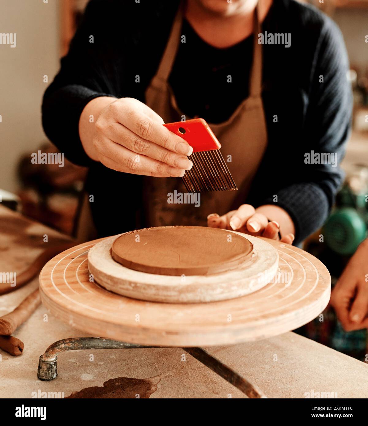 Hands, clay and pottery wheel in studio for ceramics, shape and craft ...