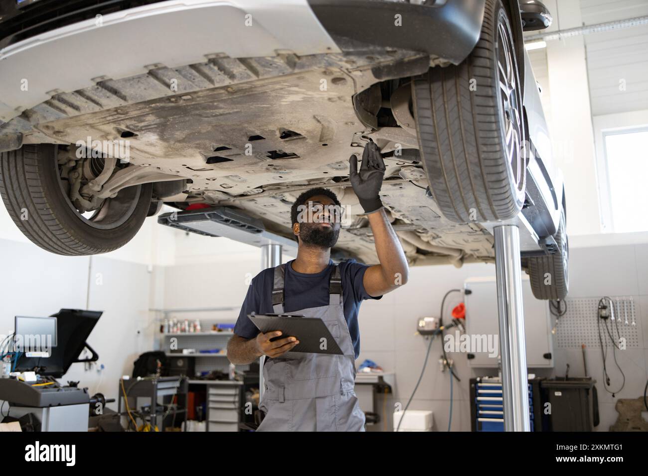 Inspecting vehicle undercarriage in hi-res stock photography and images - Alamy