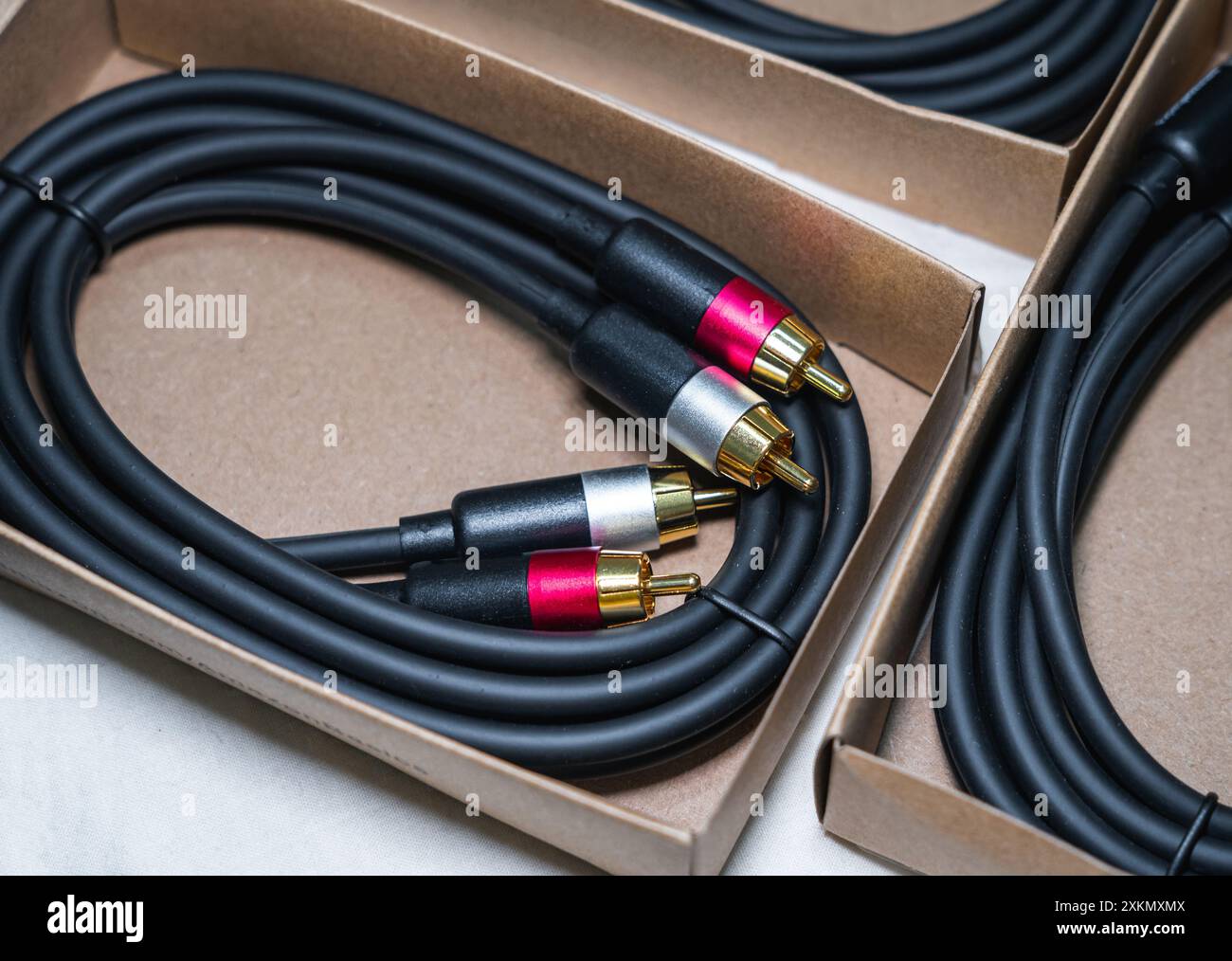 RCA cable with gold plated connector tip in a brown packaging box ...