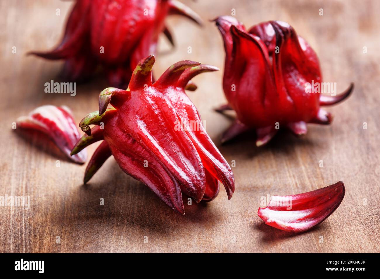 Magenta-color calyces (sepals) of roselle flowers on table Stock Photo ...