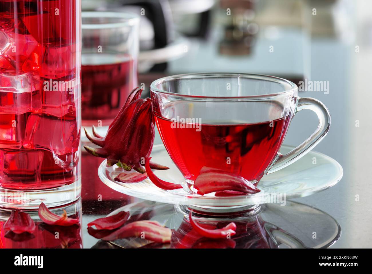 Cup of hot hibiscus tea (rosella, karkade) on kitchen table Stock Photo ...
