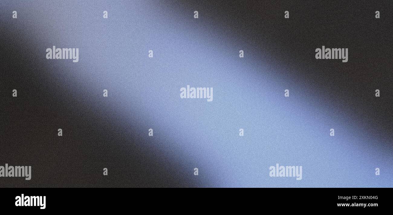 Diagonal light beam illuminating a grainy textured surface, creating a ...