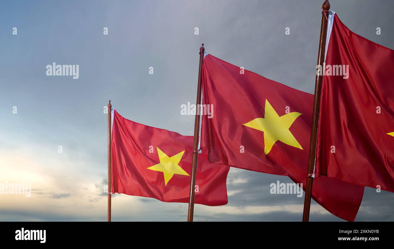Three flags of Vietnam are flying high in the sky. The flags are red ...