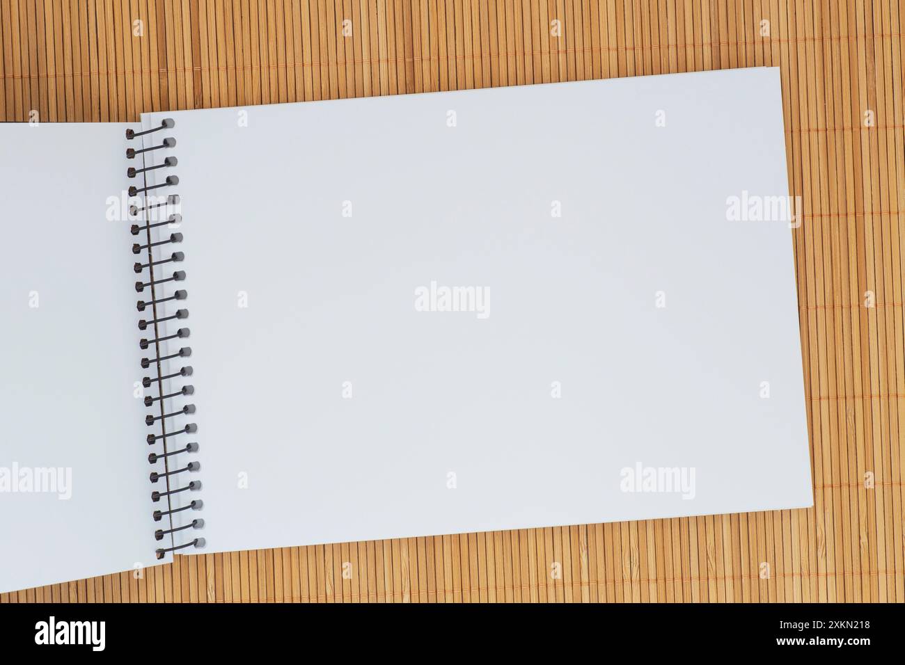 close up of blank page of sketch book laying on bamboo mat Stock Photo ...