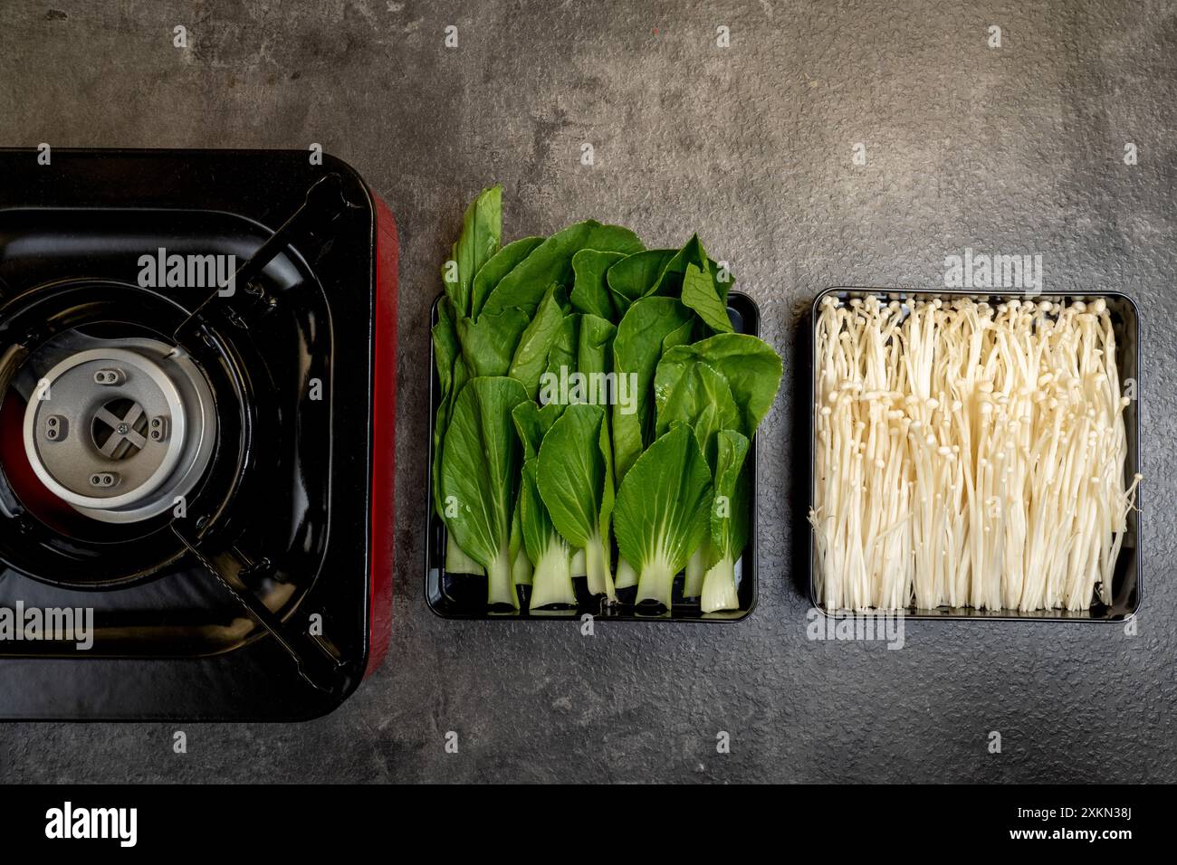 Three different types of vegetables are displayed on a countertop ...