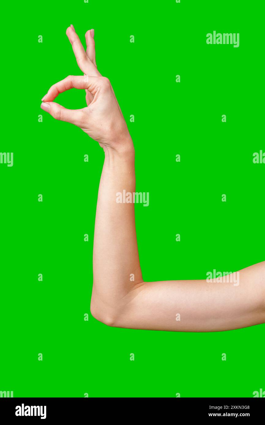 Close Up Of Woman's Hand Making Okay Sign Against Green Screen Stock ...