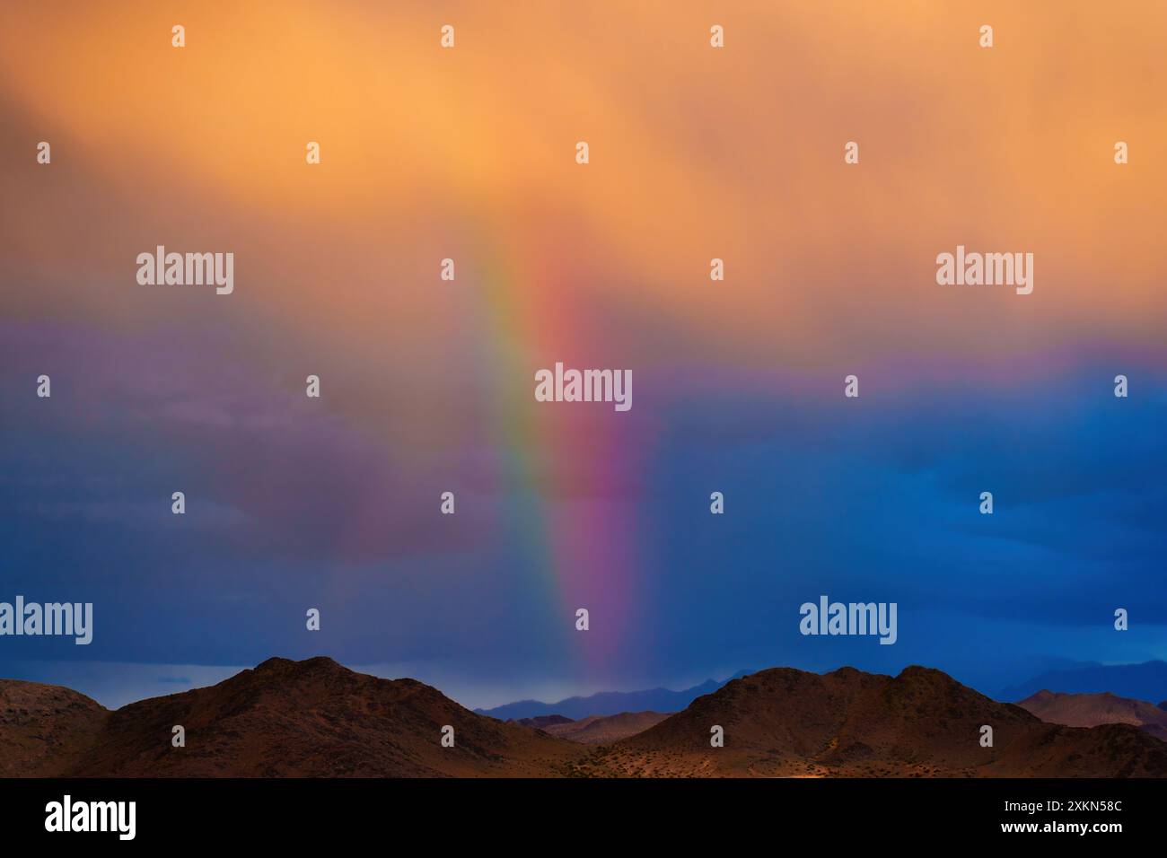 Beautiful rainbow shines brightly in dry California desert under ...