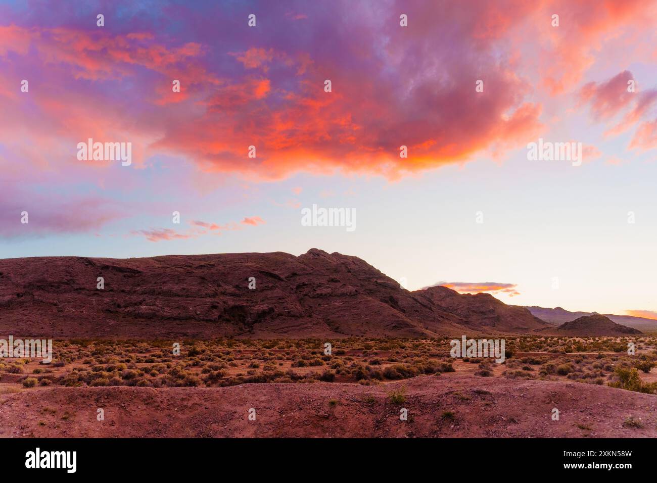 Stunning display of dramatic colors fills the sky above the rugged ...