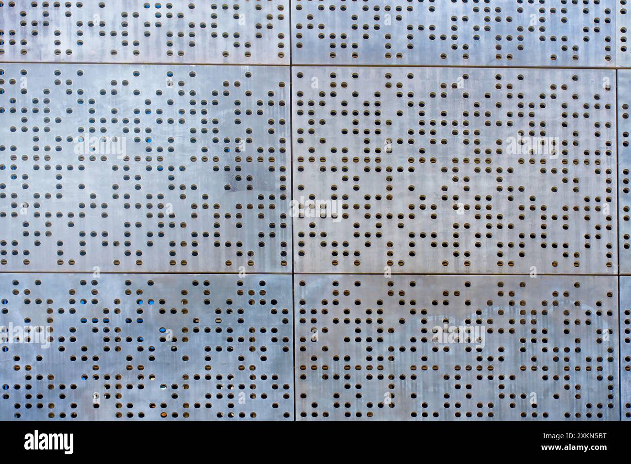 Detailed view of a modern perforated metal wall showcasing unique ...