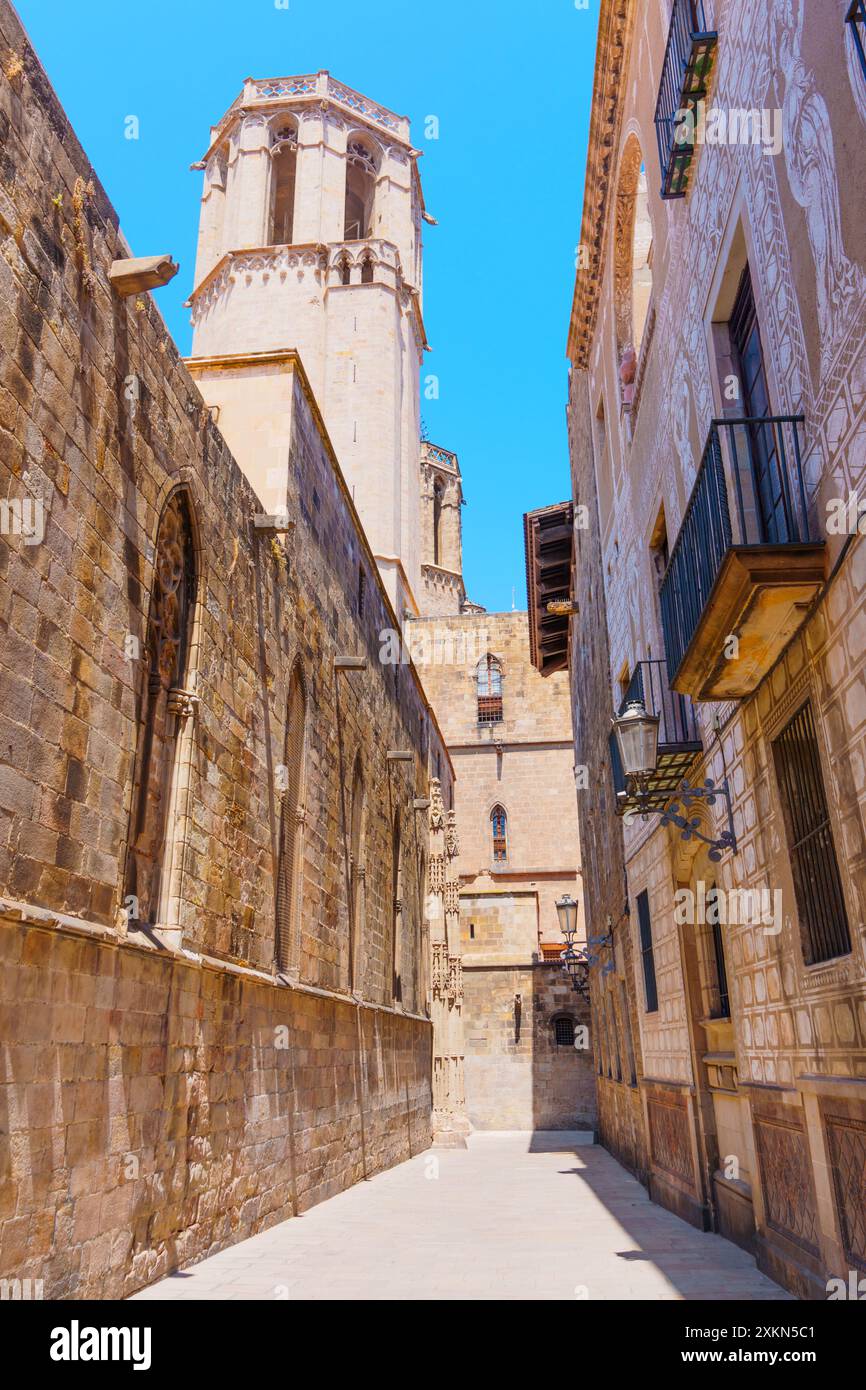 Barcelona's Gothic Quarter alley with a view of the historic tower ...