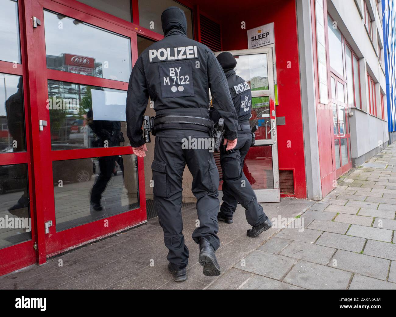 Police enter premises hi-res stock photography and images - Alamy