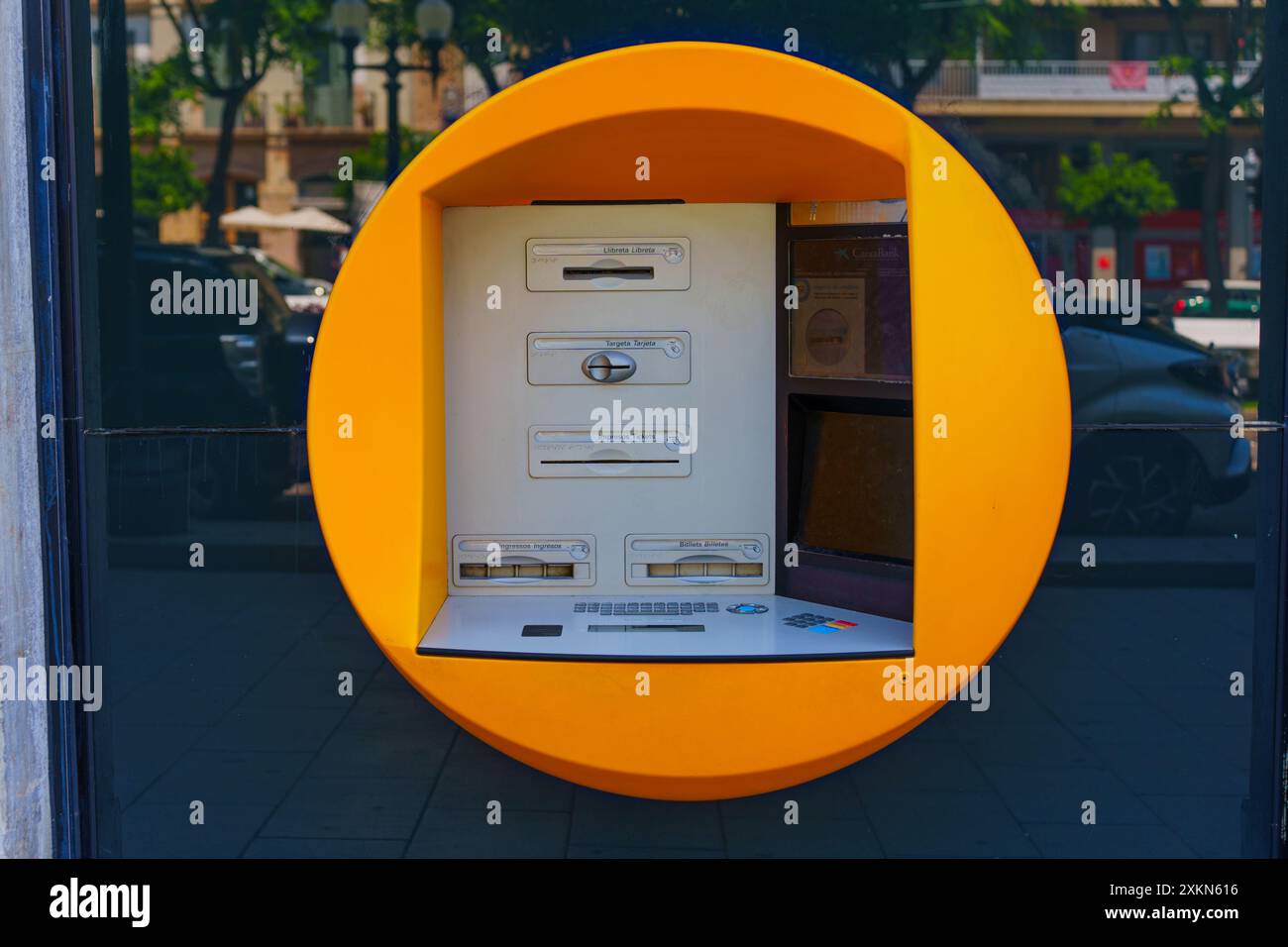 Tarragona, Spain - July 15, 2024: Unique yellow circular ATM structure ...