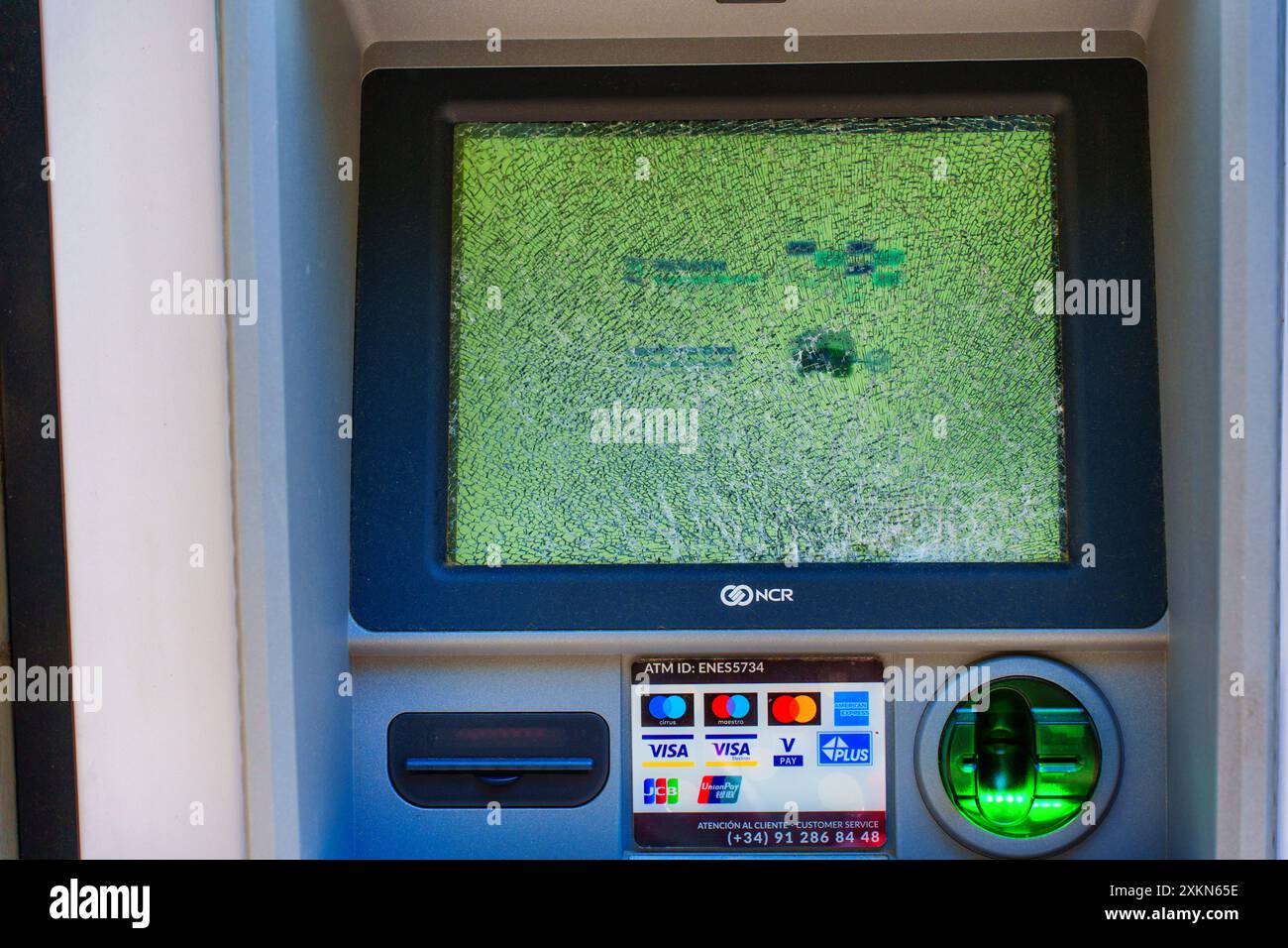 Barcelona, Spain - July 16, 2024: ATM screen exhibiting glitches with ...