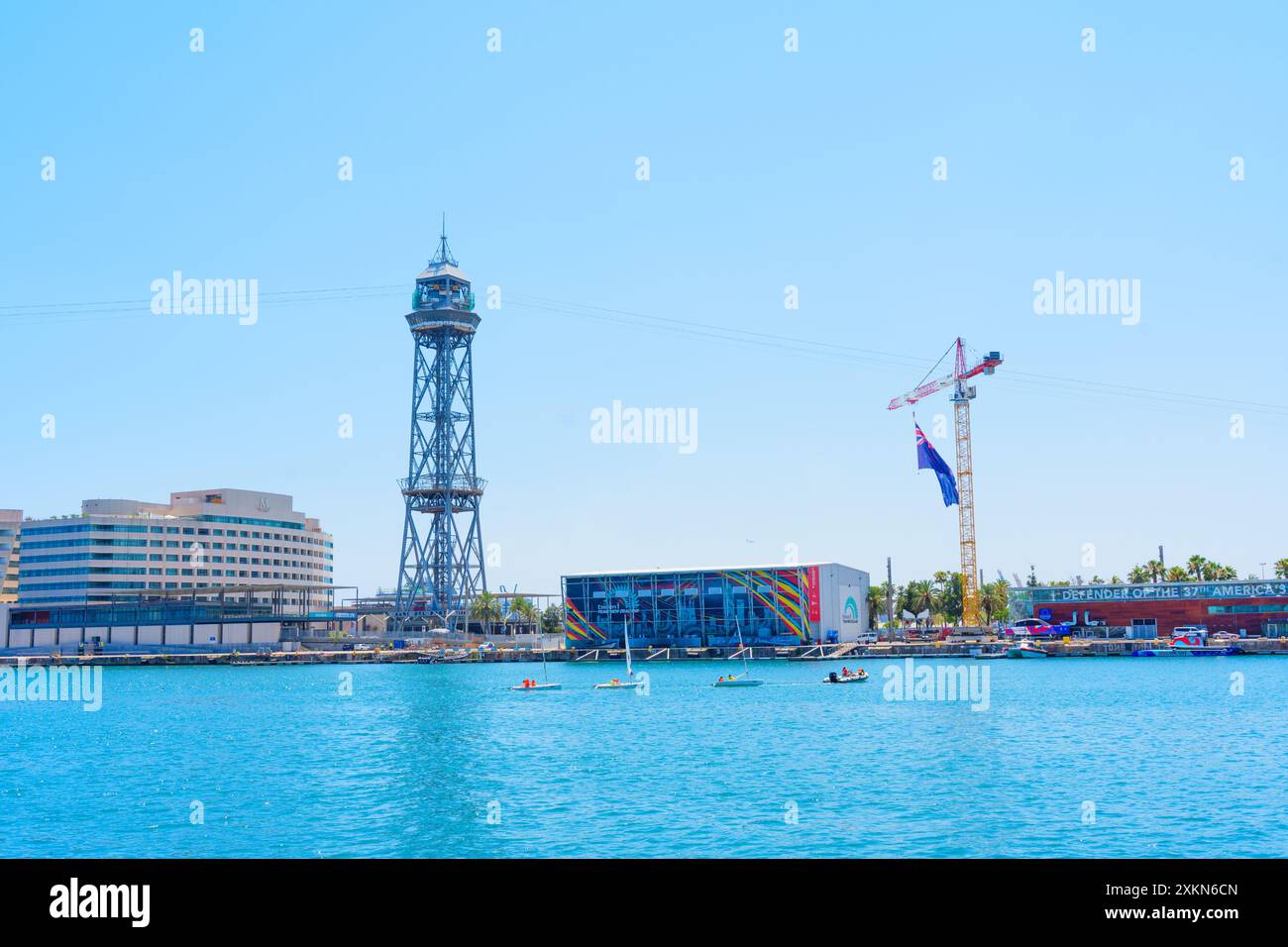View of Port Vell Aerial Tramway tower near harbor and buildings Stock ...