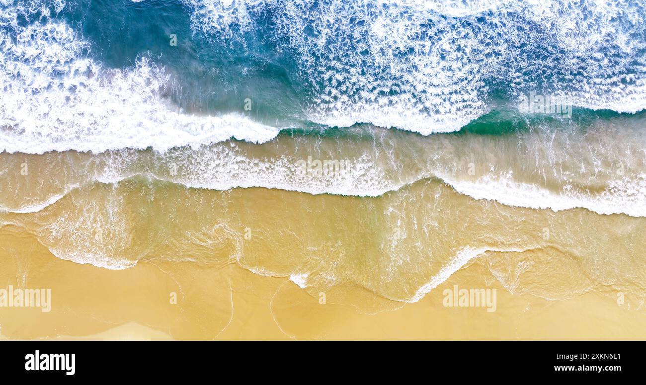 Waves, water splashes, sand Idyllic seascape. Sand Sea Shore with Blue ...