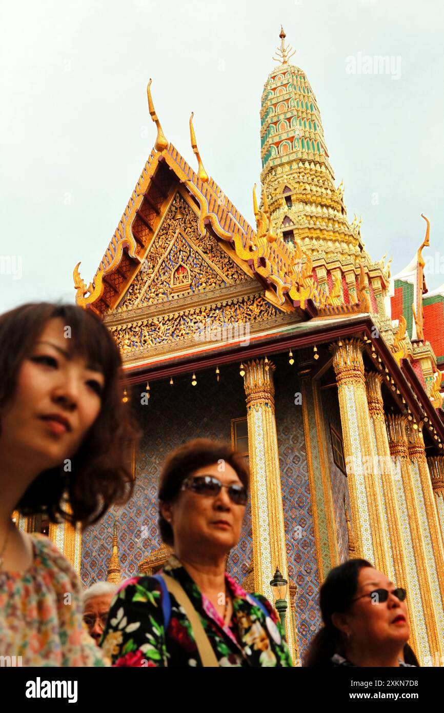 A group of women tourists visiting Grand Palace complex in Bangkok City ...