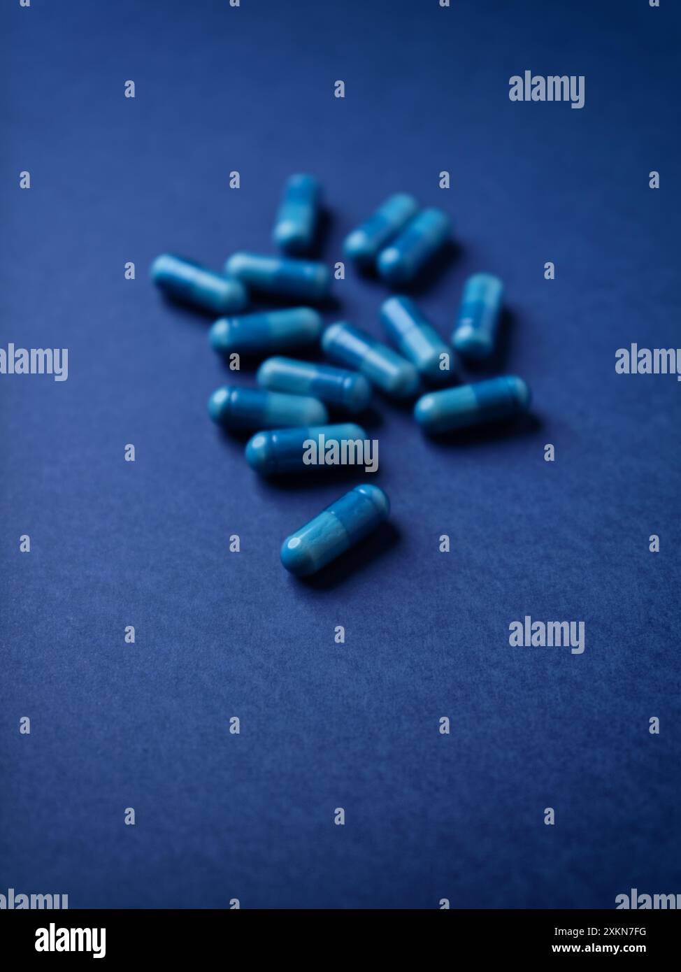 Amino acids capsules on dark paper background. Soft focus Stock Photo ...