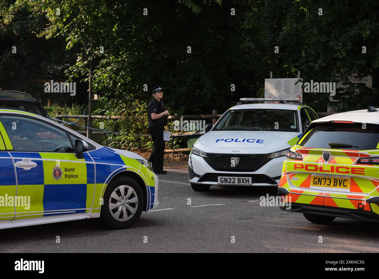 Police vehicles beside a cordon at the scene in Sally Port Gardens in ...