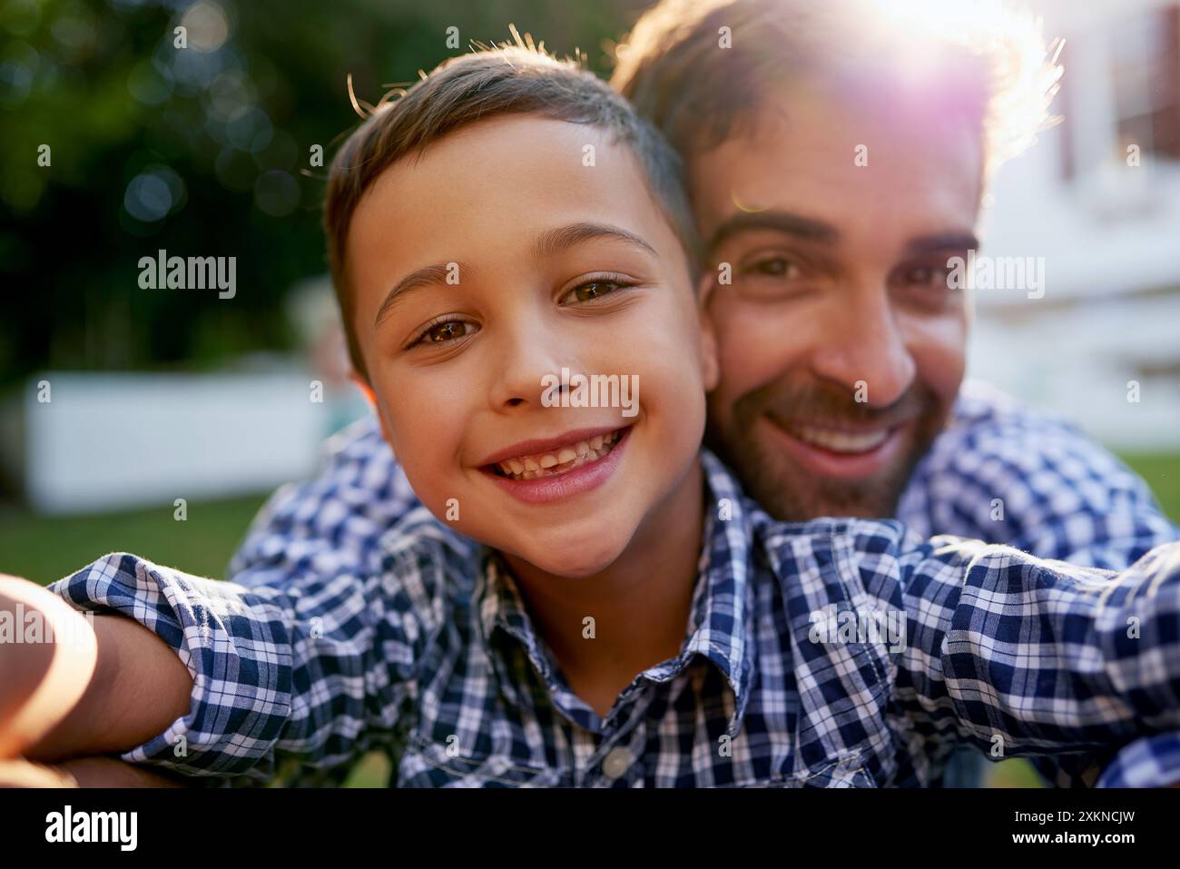 Selfie, father and son with portrait outdoor in garden of home for ...