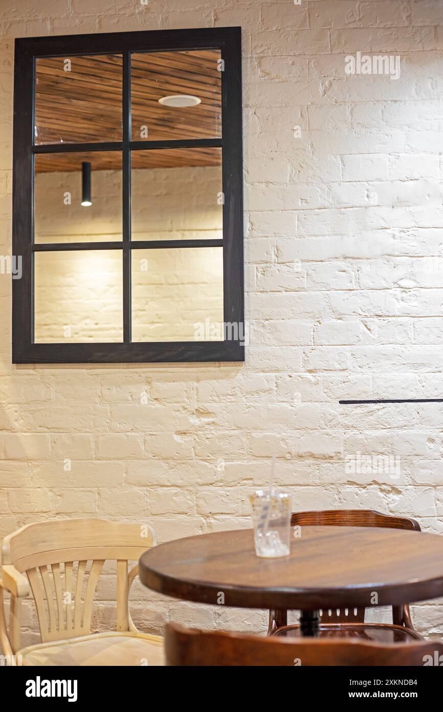 modern cafe interior with mirror window and home flowers. Fashion ...