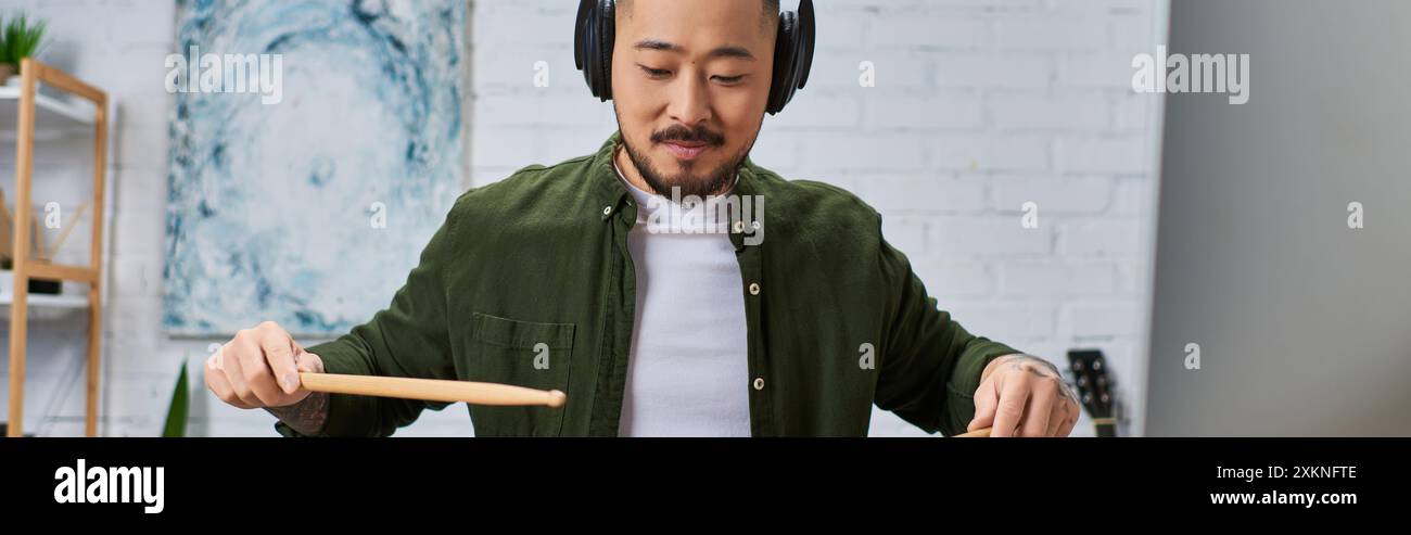 Asian man playing an instrument hi-res stock photography and images - Alamy