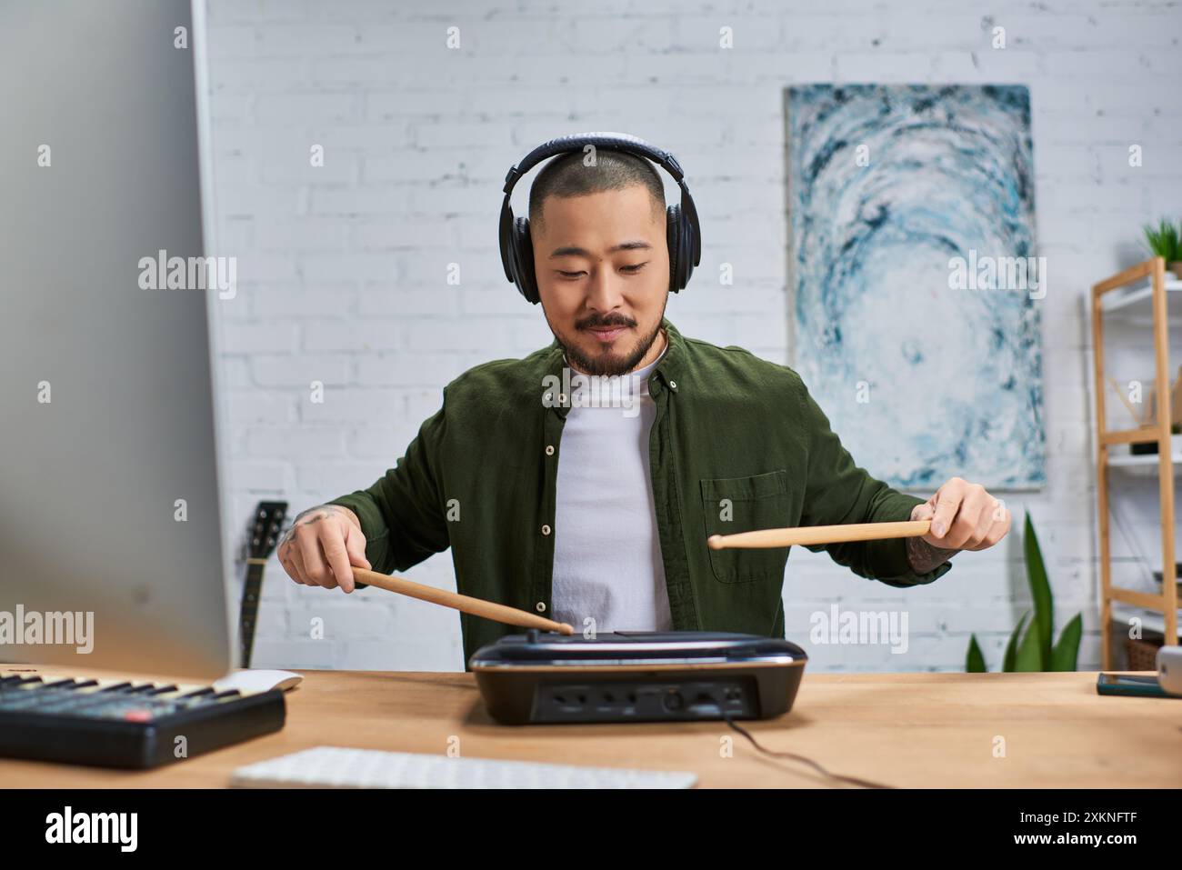 A man plays the drums in his studio, creating beats and music Stock ...