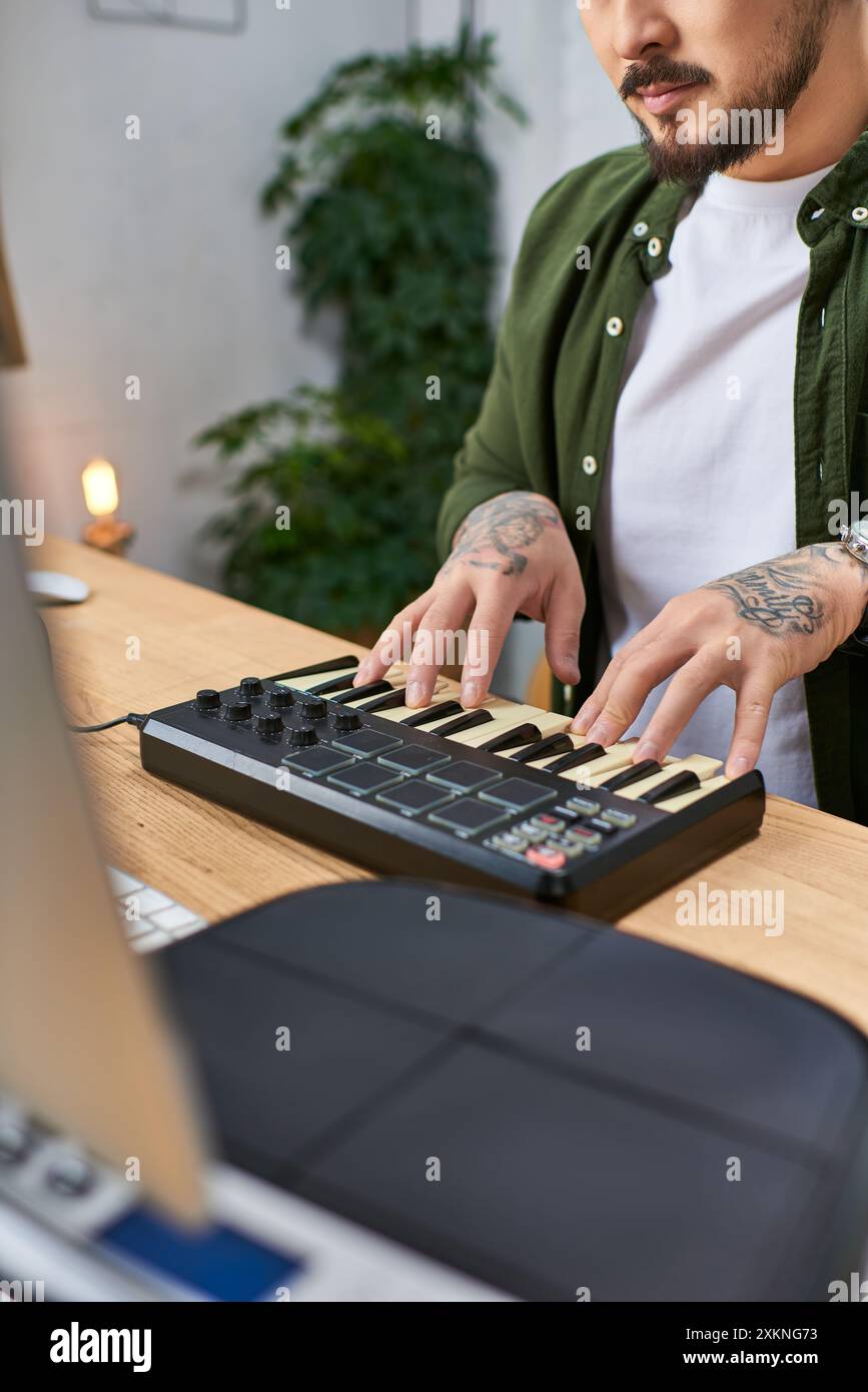 A close-up of a mans hands playing a MIDI keyboard in his studio Stock ...