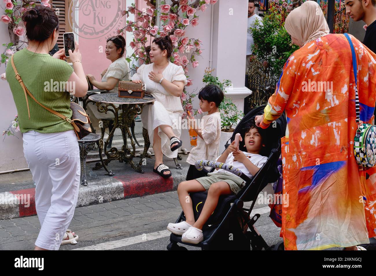 Tourists at a popular photo spot in Soi Romanee (Rommani) in the Old ...