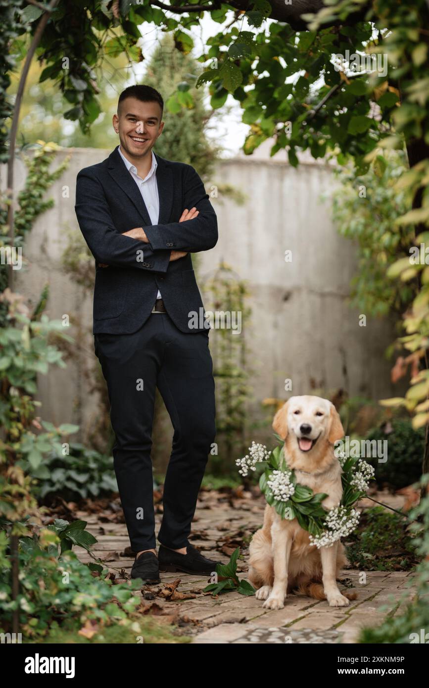 portrait of a young guy groom in a dark wool suit Stock Photo - Alamy
