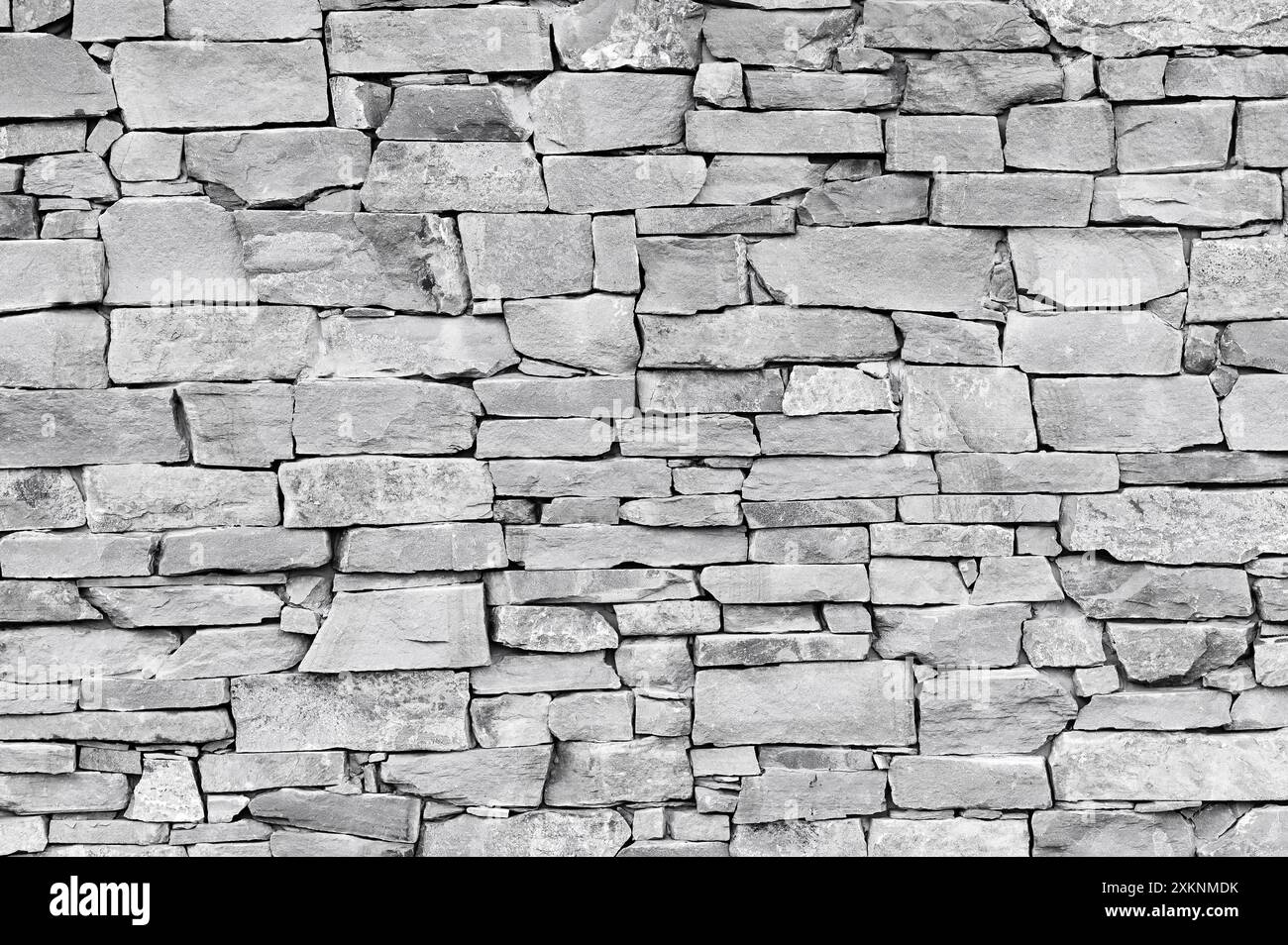 Stacked stone brick wall. background Stock Photo - Alamy