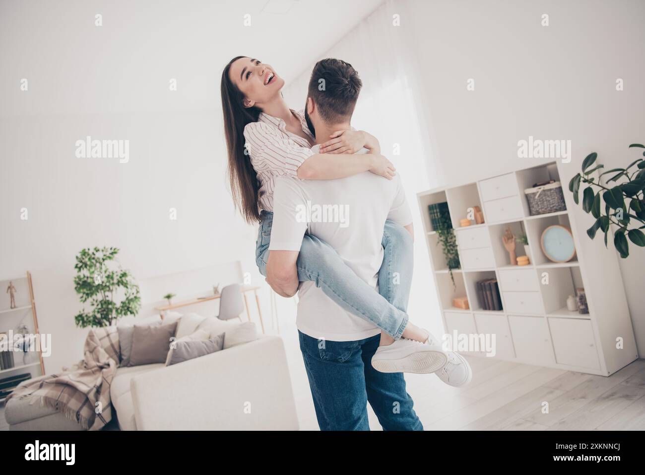Photo of cheerful cute young couple enjoy weekend couple cuddle husband ...